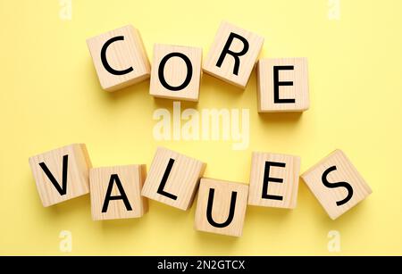 Cubes with phrase CORE VALUES on wooden background, flat lay Stock ...