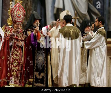 Armenian Catholic patriarch Nerses Bedros XIX Tarmouni, left, greets ...