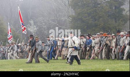 Confederate soldiers charge Union troops during a re-enactment of the ...