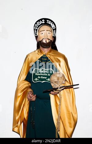 A penitent poses for a picture dressed with typical Apostle dress ...