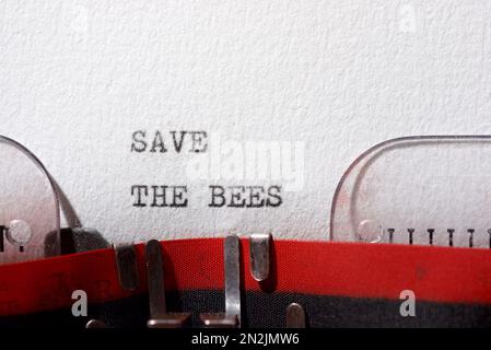 Save the bees text written with a typewriter Stock Photo - Alamy