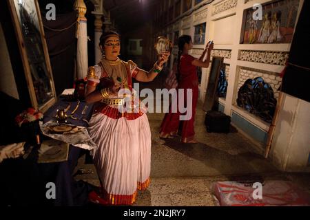 Indian classical dancer Usha Nangiar looks into the mirror before going ...