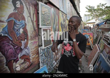 Congolese artist visiting his posters in Kinshasa Stock Photo - Alamy
