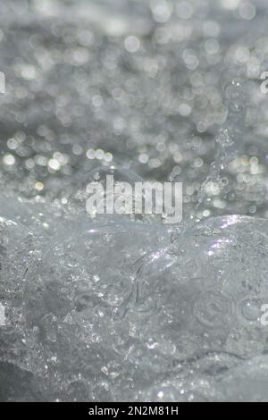 Splashes and drops of sea wave at break Stock Photo - Alamy