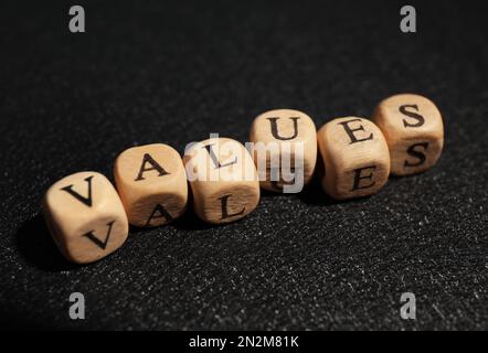 Beads with word VALUES on black background Stock Photo - Alamy