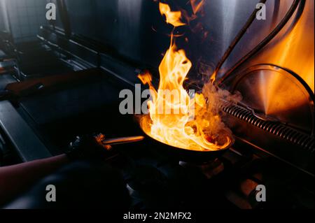 Fire in the kitchen. hell kitchen Stock Photo - Alamy