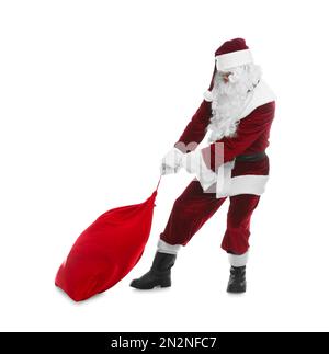 Portrait of Santa Claus pulling big bag on white background Stock Photo ...