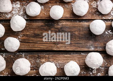 Frame of snowballs on wooden background, flat lay. Space for text Stock ...