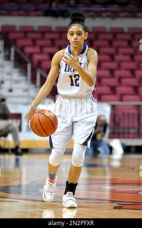 St. Joseph Central Mychelle Johnson (12) drives the lane with Wheeling ...