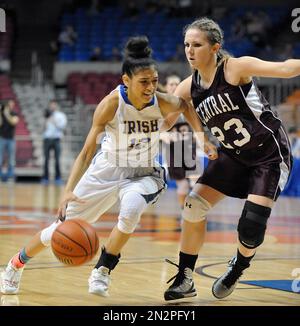 St. Joseph Central Mychelle Johnson (12) drives the lane with Wheeling ...