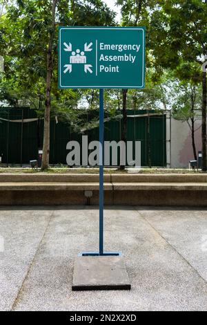 Emergency assembly point. Sign in a city against a clear blue sky. Sign ...