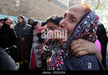 A homeless woman, who lives in a pedestrian underpass, eats food ...
