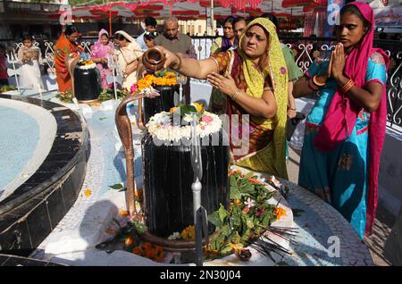 Hindu devotees worship a 'Shivling', a symbolic representation of Hindu ...