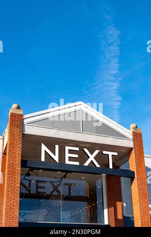 Next store sign logo Stock Photo - Alamy