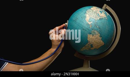 human hand examining the planet earth with a stethoscope Stock Photo ...
