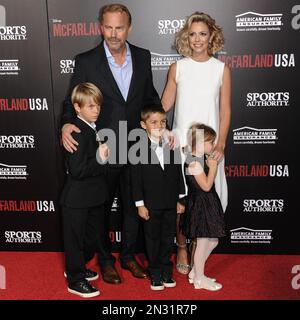 From left, Kevin Costner, Christine Baumgartner, Hayes Logan Costner ...