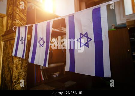 Flags of Israel inside the synagogue Stock Photo - Alamy