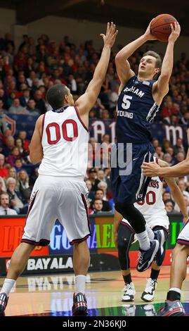 BYU guard Kyle Collinsworth (5) shoots as Utah forward Jakob Poeltl (42 ...