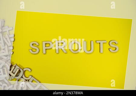 SPROUTS in wooden English words language capital letters spilling from ...