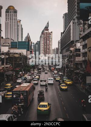 Vertical shot of tall buildings and a busy street in Hong Kong Stock ...