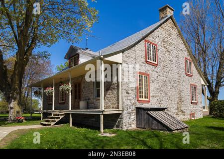 Old 1835 fieldstone house with silver sheet metal roof in spring Stock ...