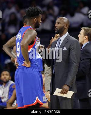 Philadelphia 76ers assistant coach Lloyd Pierce, left, talks with guard ...