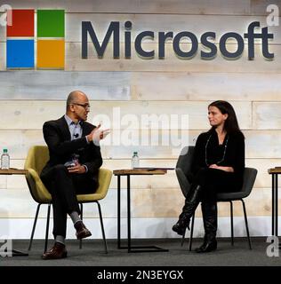 Satya Nadella, CEO of Microsoft, left, and Vrinda Kapoor, co-founder of ...