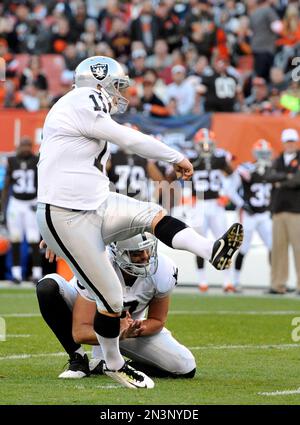 Oakland Raiders placekicker Sebastian Janikowski (11) leaps after ...