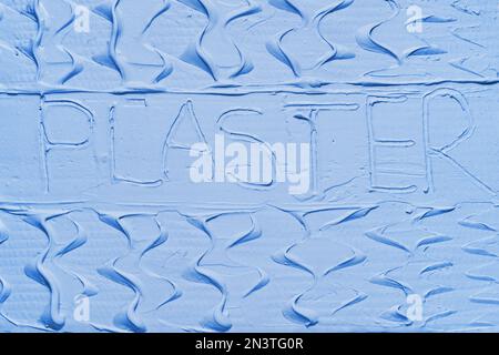 Plaster wall with blue decorative letter slot mailbox. Horizontal shot ...