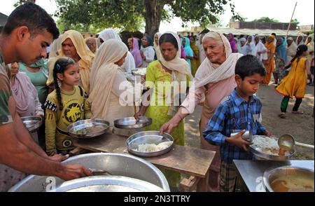 Indian villagers, who fled from their homes after the exchange of ...