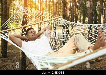 Handsome man resting in the hammock Stock Photo - Alamy