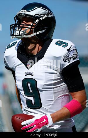 Philadelphia Eagles' Nick Foles (9) walks off the field with Jeremy ...
