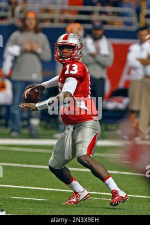 New Mexico quarterback Lamar Jordan celebrates after scoring a ...