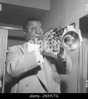 Louis Armstrong (1901-1971), African American Jazz musician, conducting ...