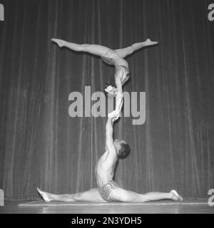 1940s acrobatic show. The three acrobats performs a balance act on ...