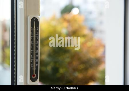 Weather thermometer on window frame indoors. Space for text Stock Photo ...