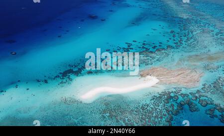 Small sand cay with a remote weather station on surrounded by fringing ...