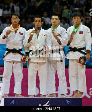 Gold medallist North Korea's Hong Un-jong stands in front of her ...