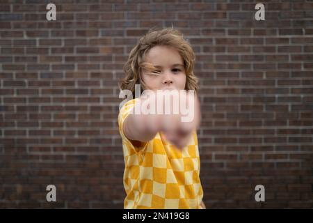 Kid boy with angry expression. Angry hateful little aggression boy ...