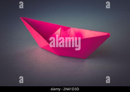 Pink paper boat origami isolated on a blank grey background Stock Photo ...