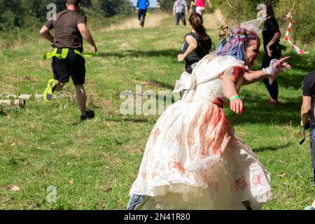 Zombie bride at a Zombie Evacuation event where runners on an assault ...
