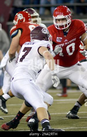 Montana defensive end Derek Crittenden (47) looks to recover a fumble ...