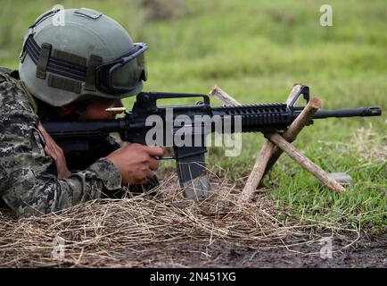 A Philippine Army Light Reaction Regiment (LRR) member instructs team ...