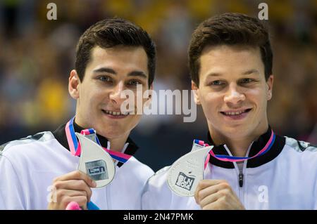 Silver medal winners Germany's Stephan Feck, left, and Patrick Hausding ...