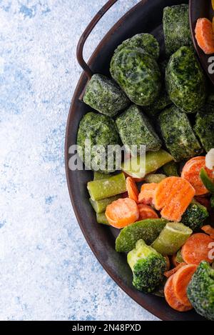 Different frozen vegetables in bowl isolated on white Stock Photo - Alamy