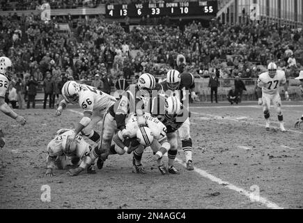 Jim Plunkett, quarterback of the New England Patriots, has his jersey ...