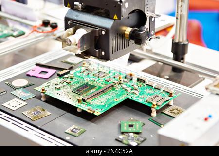 Electronic boards and chips, industrial microscope and monitors Stock ...