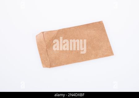 Kraft brown paper square perforated closure envelope on white ...