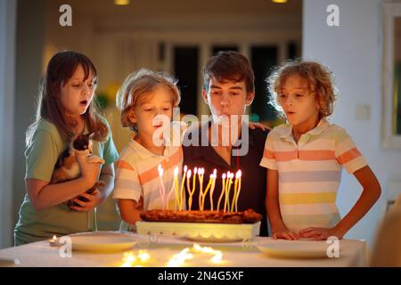 Teenager boy birthday with family and younger brother and sister ...