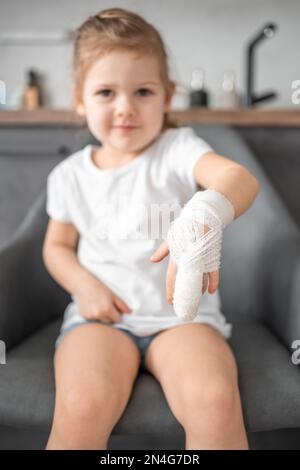 Little girl with broken finger at the doctor's appointment in the ...